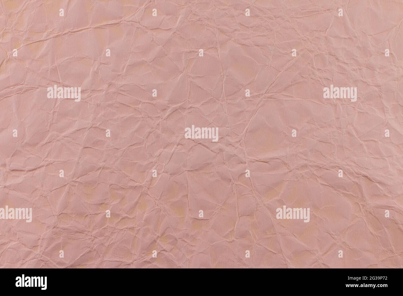 Pink wrinkled paper, used as background Stock Photo - Alamy