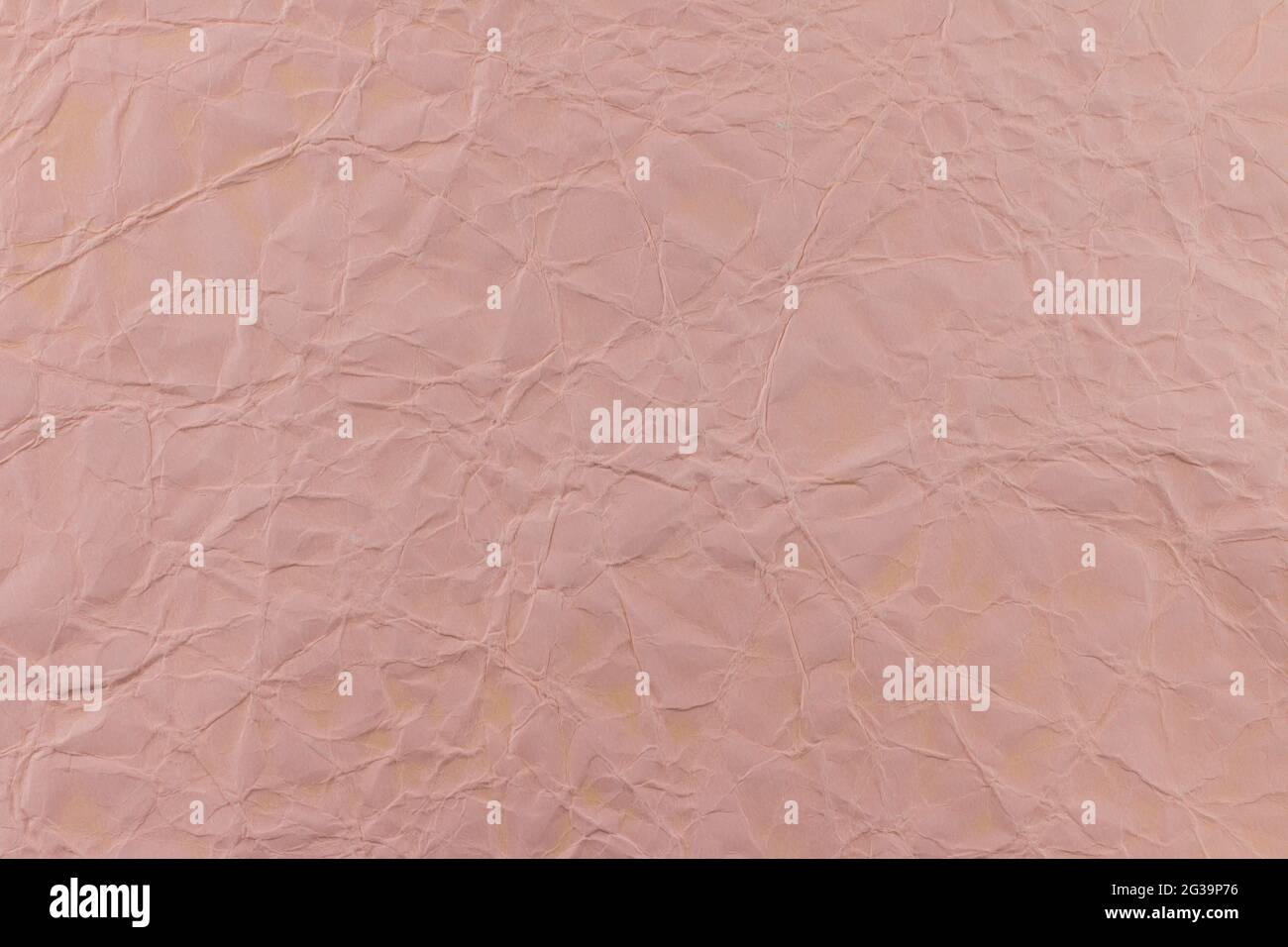 Pink wrinkled paper, used as background Stock Photo - Alamy