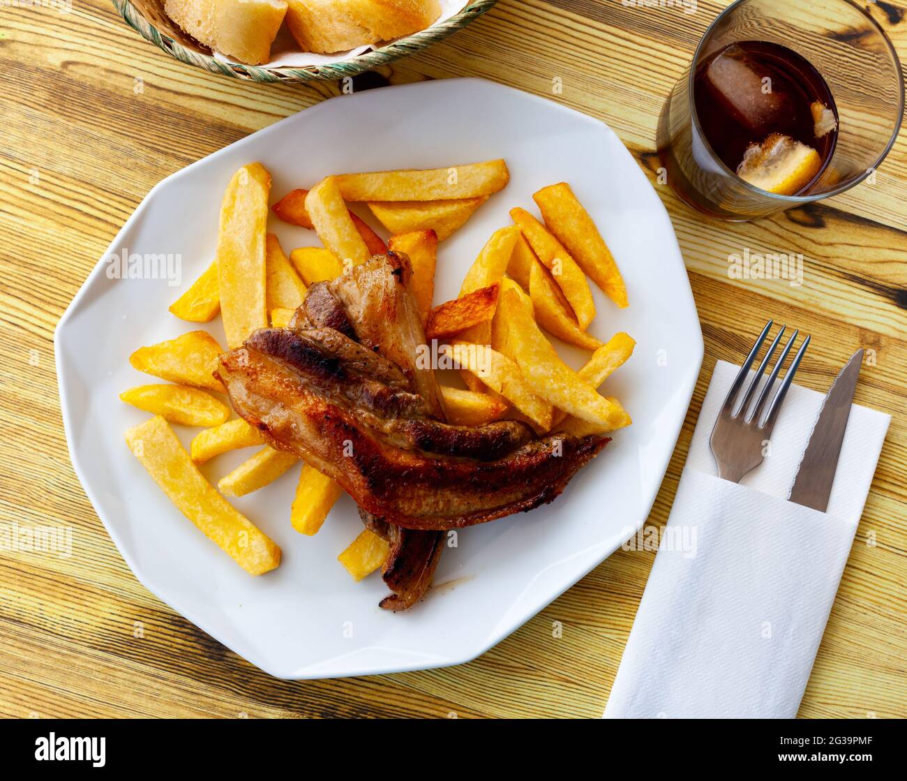 Delicious pork belly with potatoes Stock Photo - Alamy
