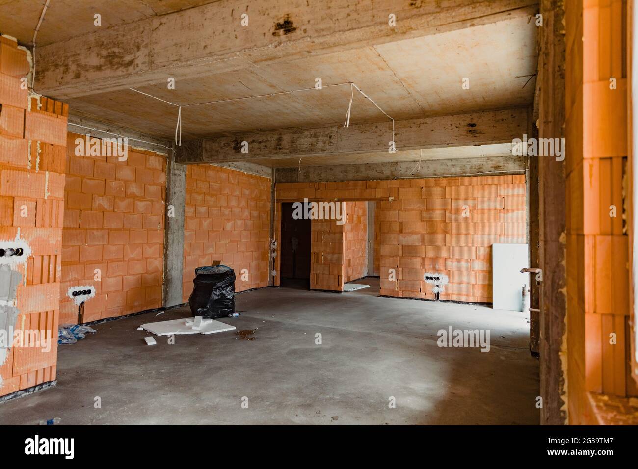 Indoor construction site with brown bricks and concrete ground Stock ...