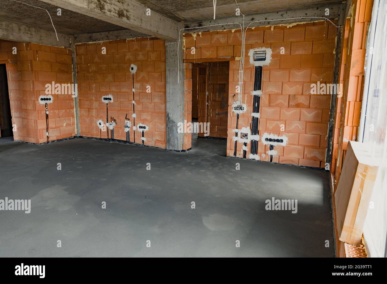 Indoor construction site with brown bricks and concrete ground Stock ...