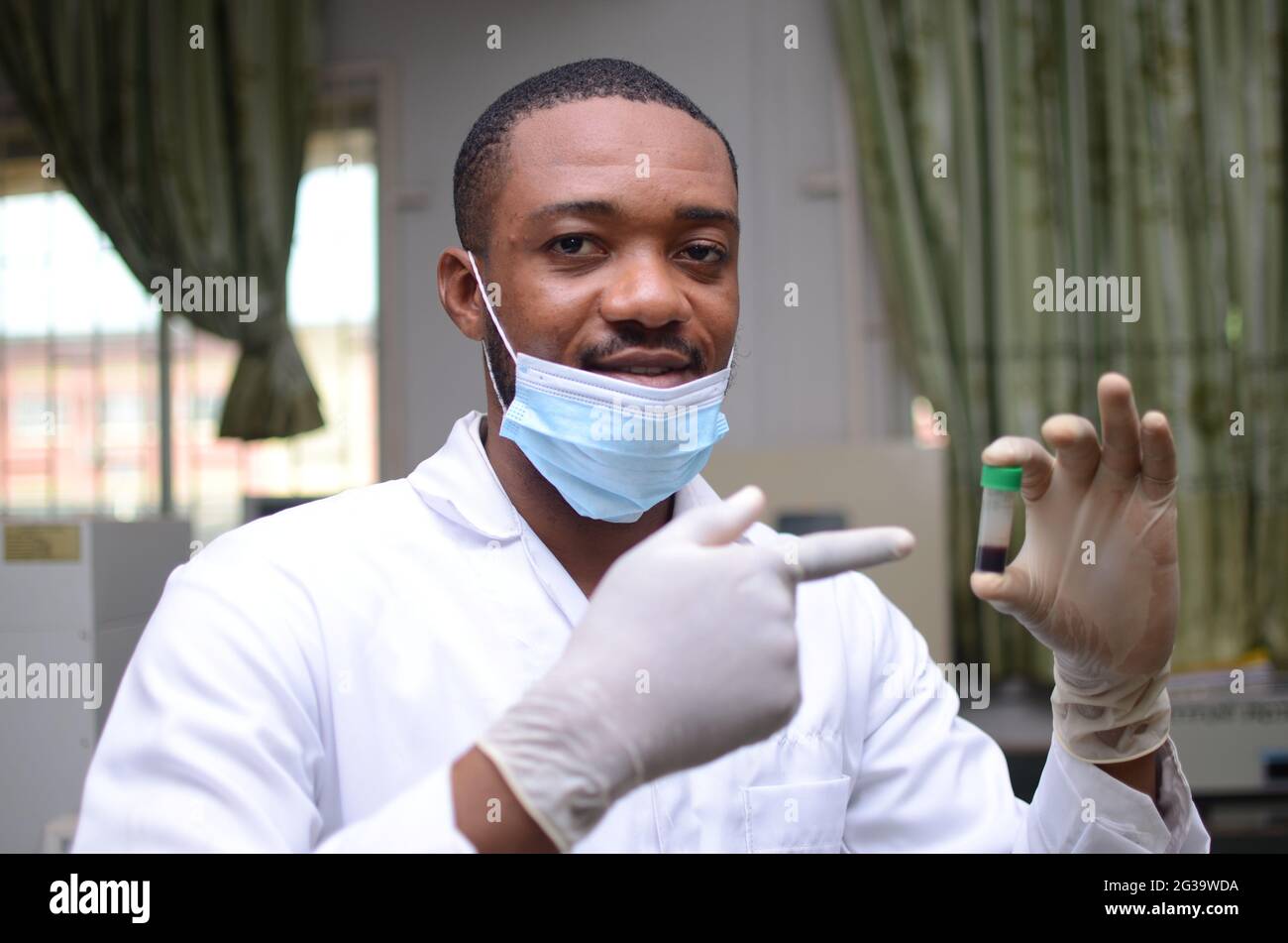 Scientist microbiologists with a uniform working with a test tube in a ...