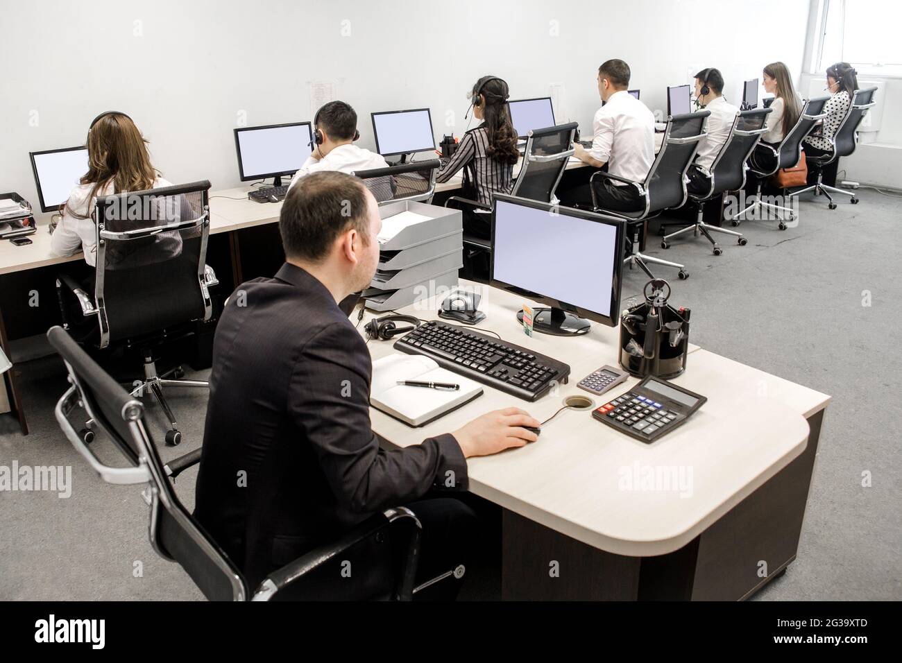 office workers at work on computers in the workplace Stock Photo - Alamy