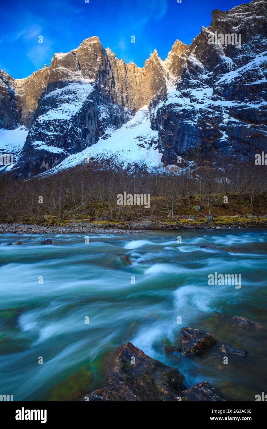 Early morning sunlight on the peaks Trolltindene and the Trollveggen ...