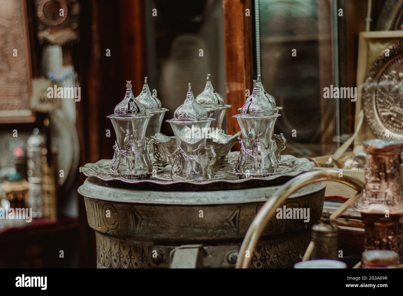 Beautiful collection of vintage teapots and silverware on display in a ...