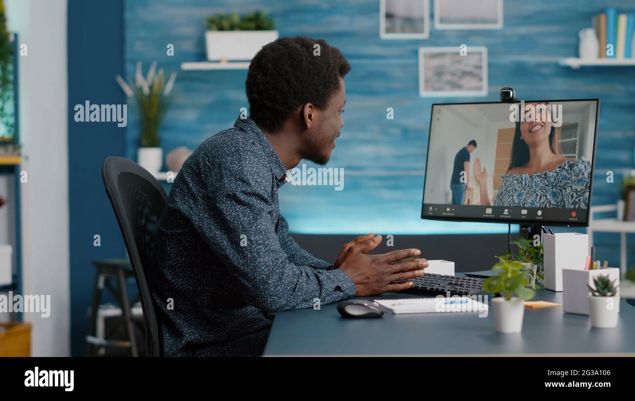 Black man at home on online video call communication, talking with ...