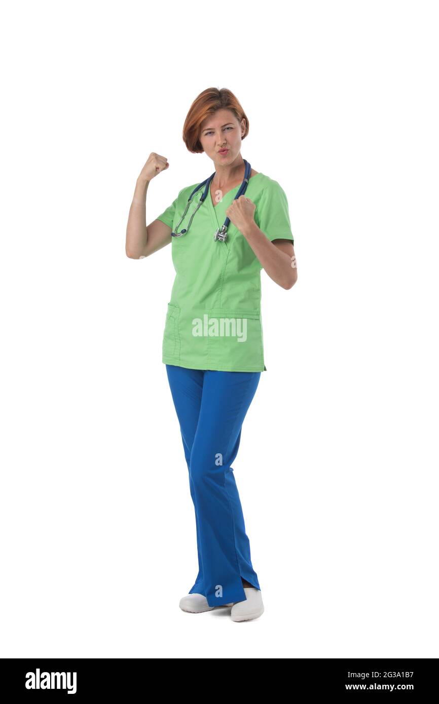 Young female medical nurse healthcare worker holding fists up isolated ...