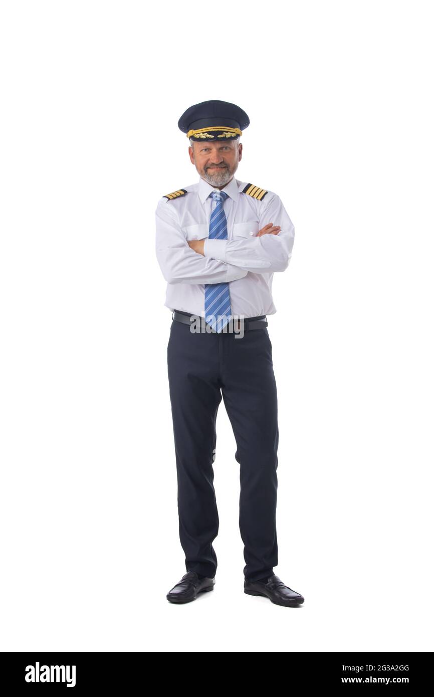Airline first pilot, aircraft commander, standing with arms folded ...