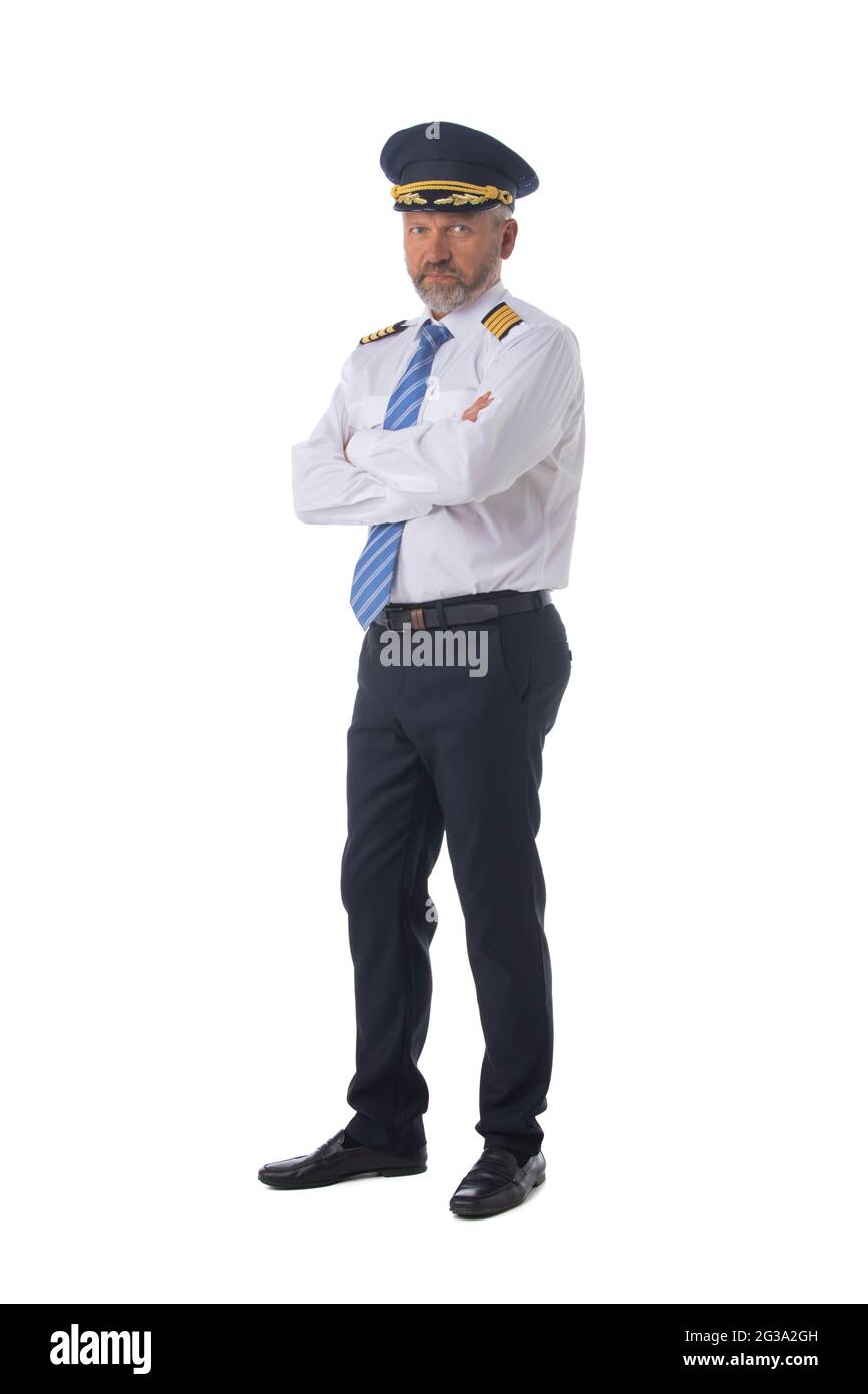 Airline first pilot, aircraft commander, standing with arms folded ...