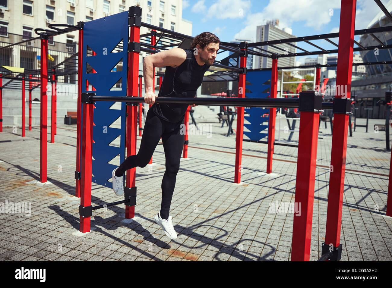 Handsome sportsman pulling up hi-res stock photography and images - Alamy