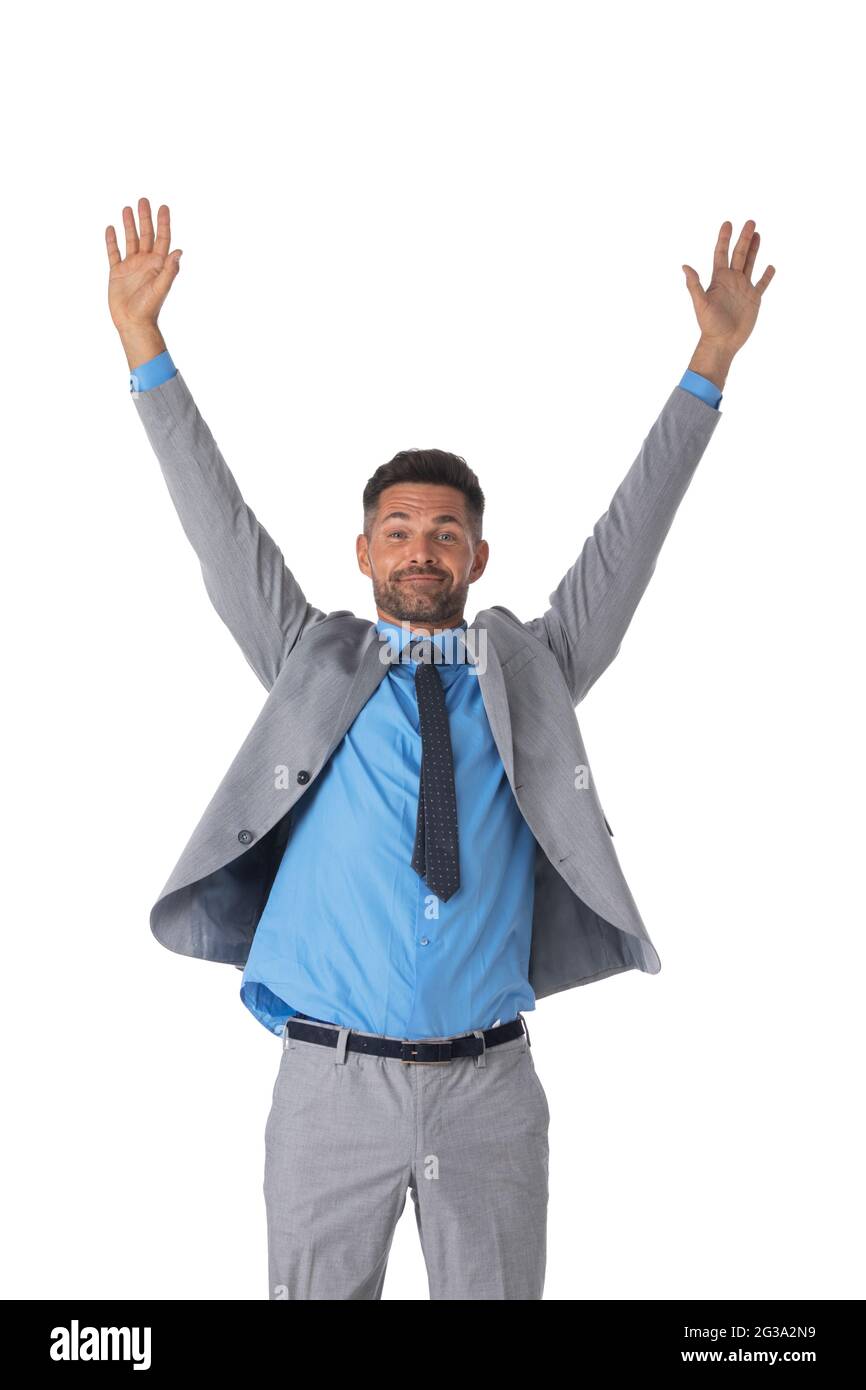 Portrait of young handsome business man in gray suit with raised arms ...