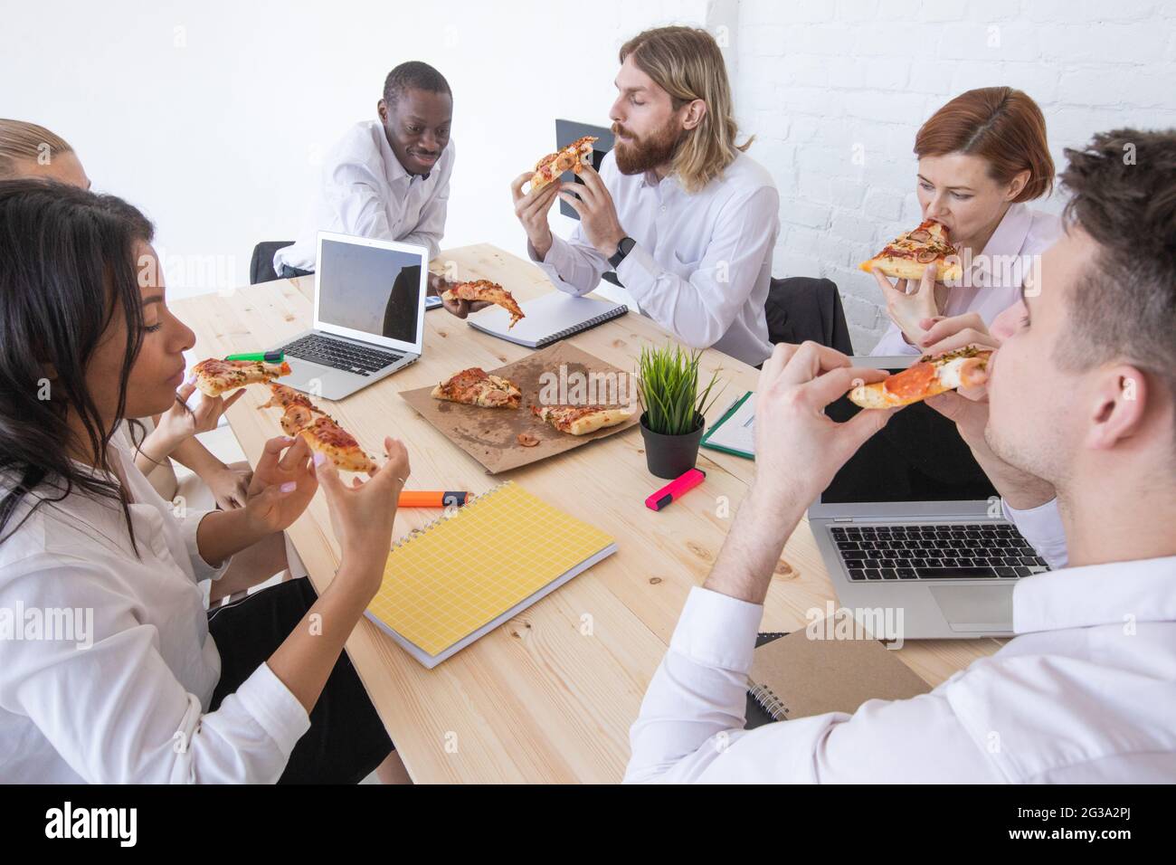 Office eating pizza slice desk hi-res stock photography and images - Alamy