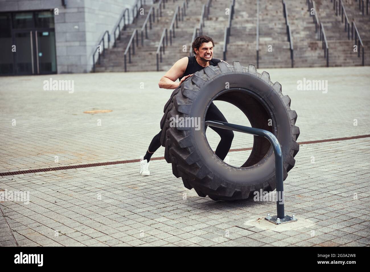 Young healthy male person demonstrating his strength Stock Photo - Alamy