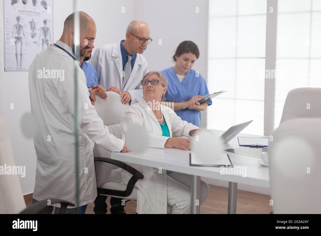 Physician hospital teamwork discussing disease expertise examining ...
