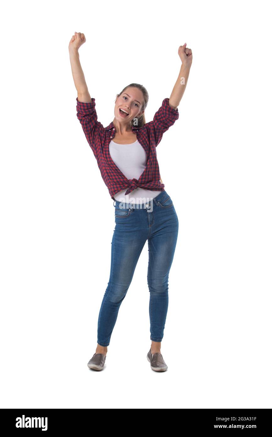 Full length portrait of smiling young woman raising her arms isolated ...