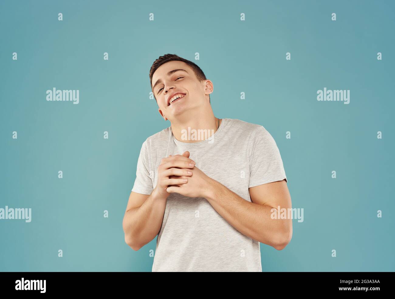 cute emotional man smile emotion blue background Stock Photo - Alamy