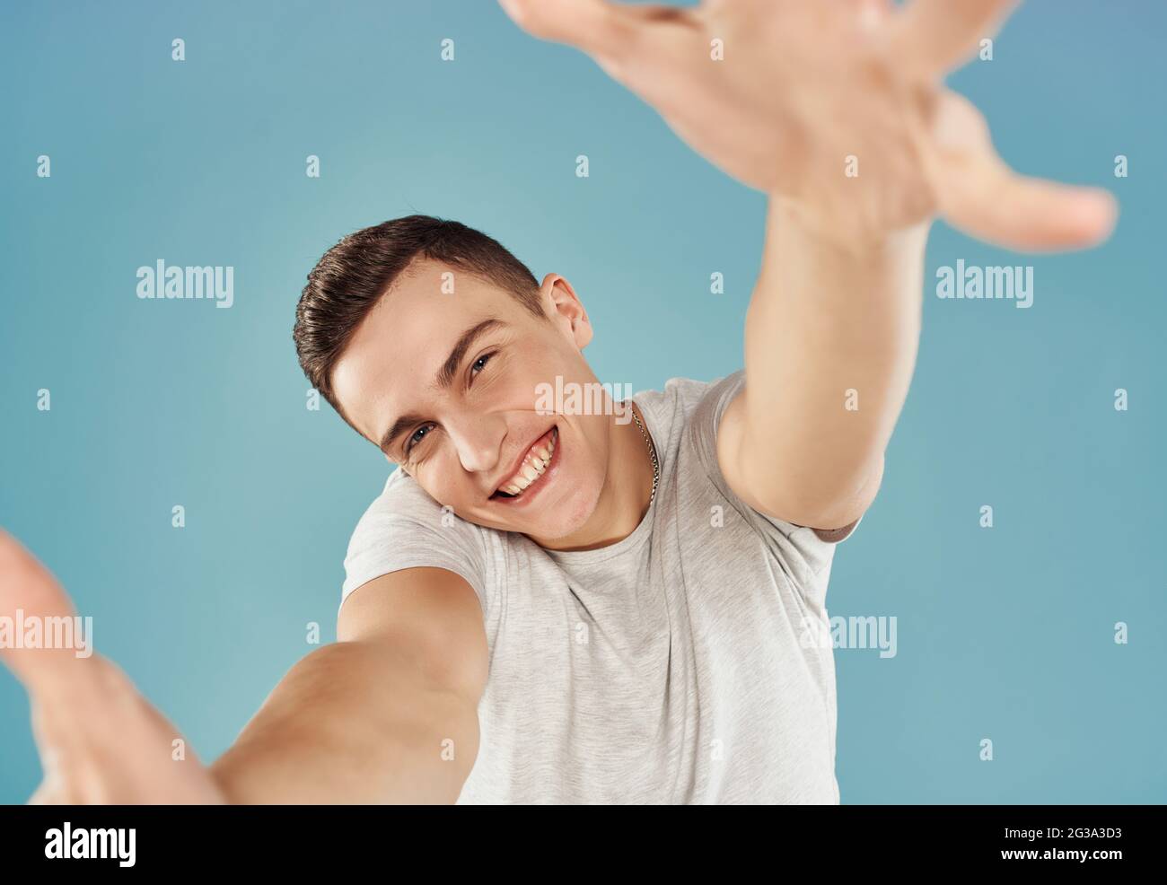 man smile emotion blue background lifestyle close up Stock Photo - Alamy