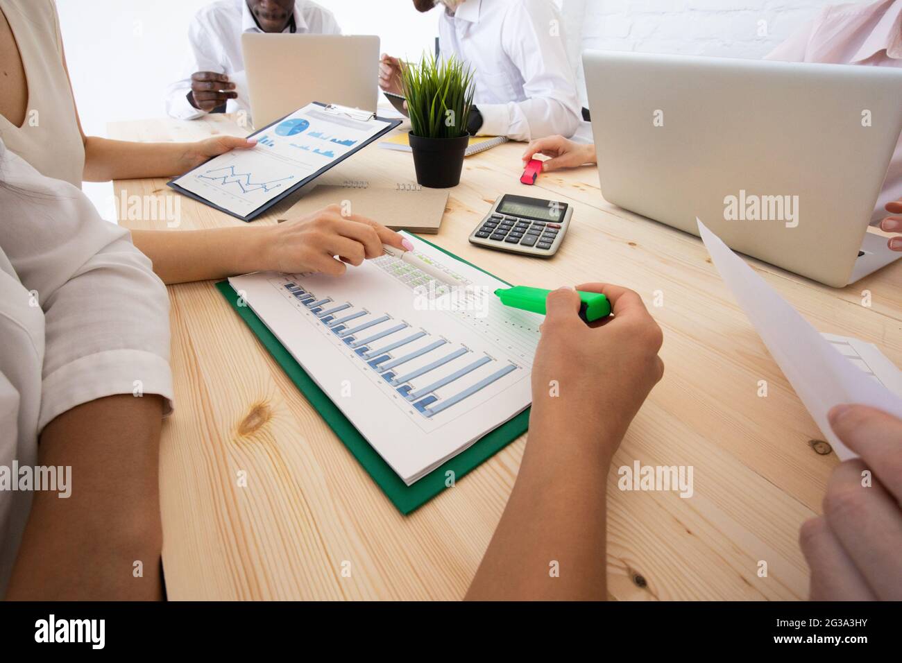Business people team discussing the charts and graphs showing the ...