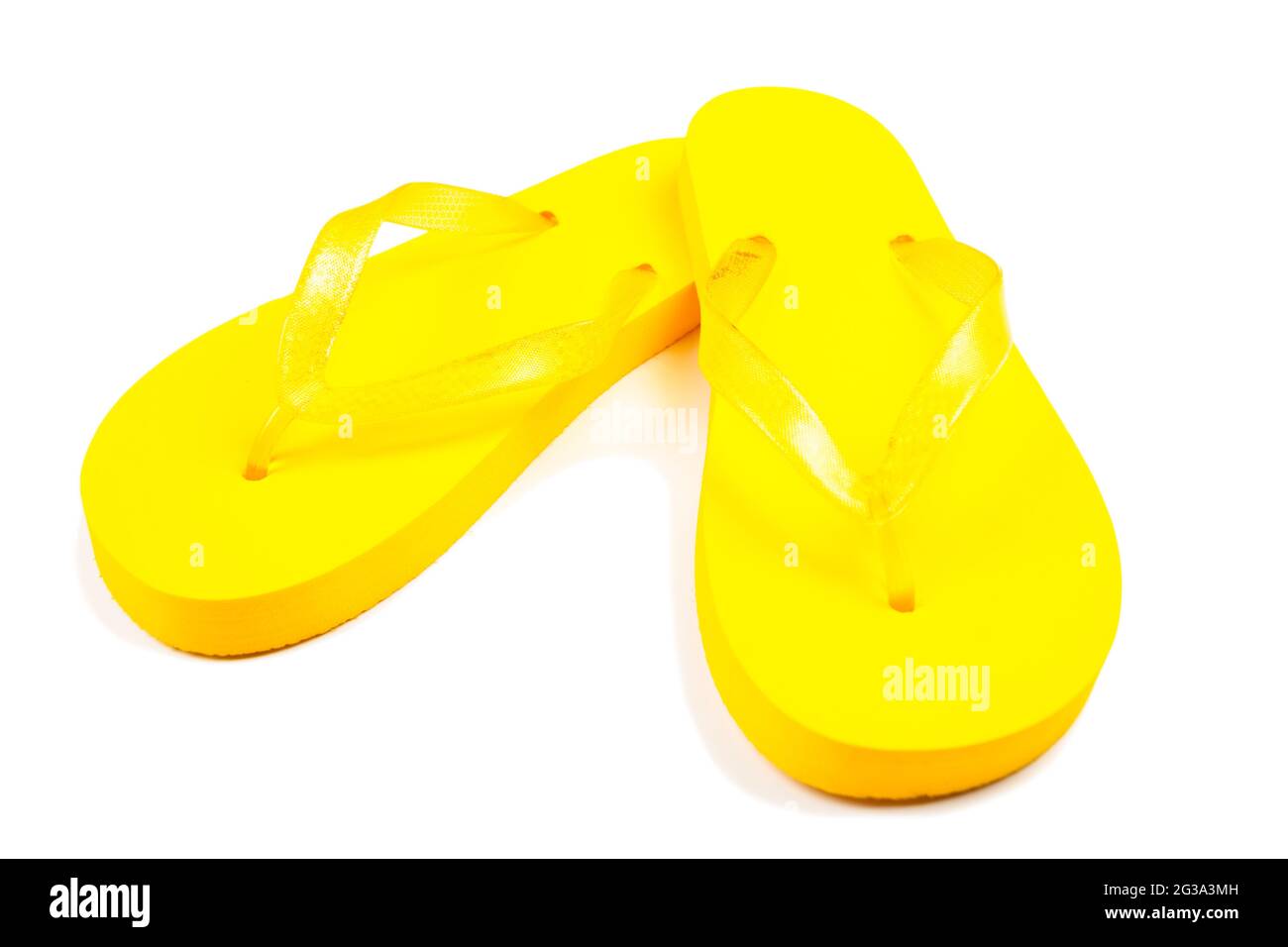 yellow rubber beach flip flops on a white background, isolate Stock ...