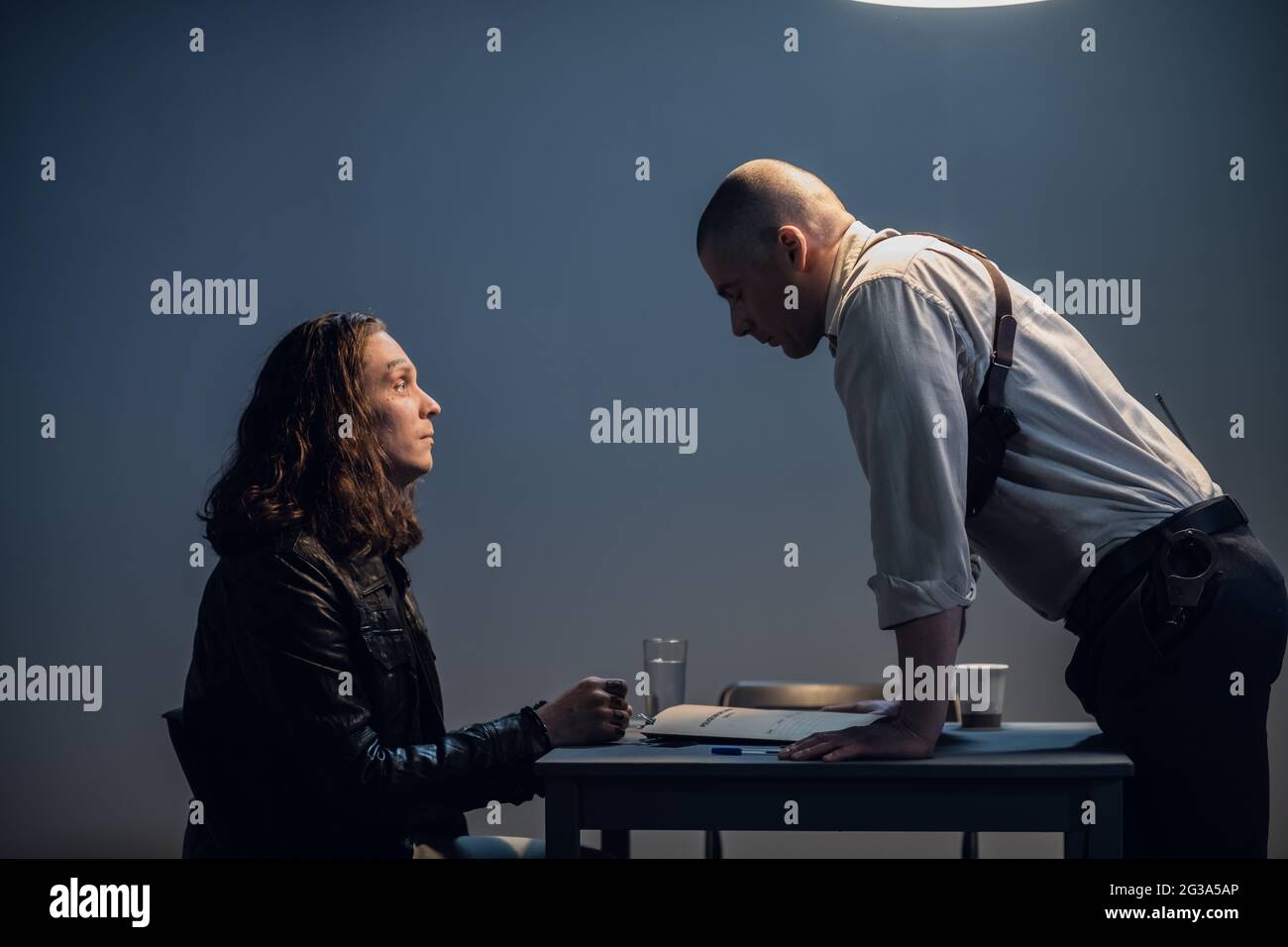 A police officer introduces the suspect to the details of the case ...