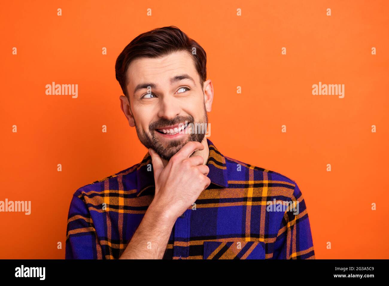 Photo of young cheerful man happy positive smile hand touch chin dream ...