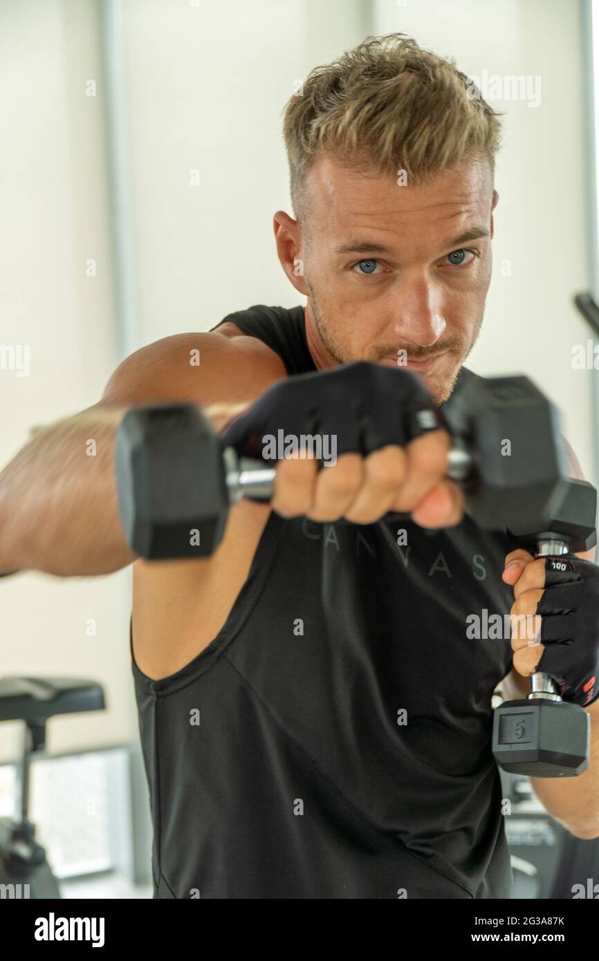 Handsome man with great body gym and pool Stock Photo - Alamy