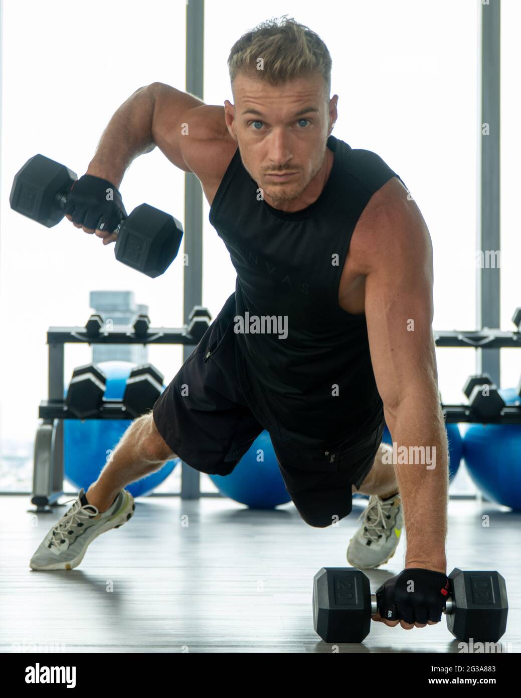 Handsome man with great body gym and pool Stock Photo - Alamy