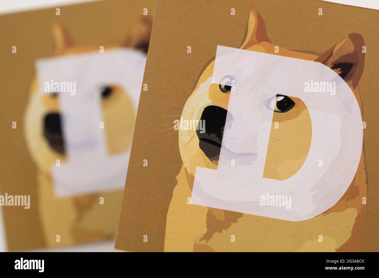 LONDON, UK - June 2021: Doge or dogecoin cryptocurrency logo on paper ...