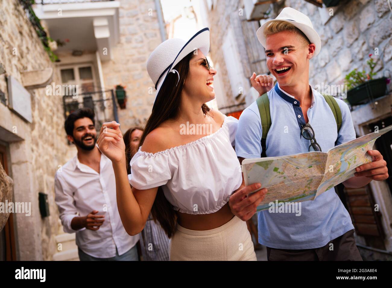 Travel, vacation and friendship concept. Group of smiling friends with ...