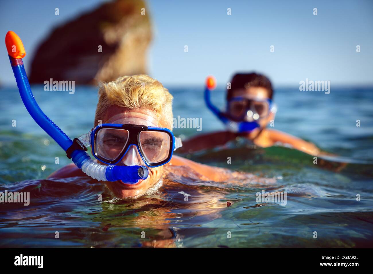 Group of happy fit friends go scuba diving together on summer vacation ...