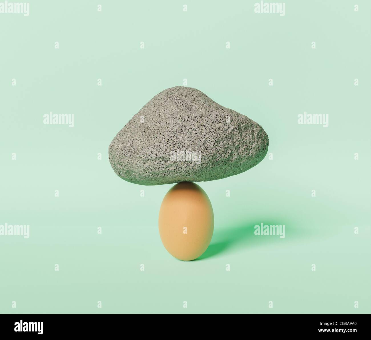 Minimalist scene of an egg with a heavy rock on top on pastel ...