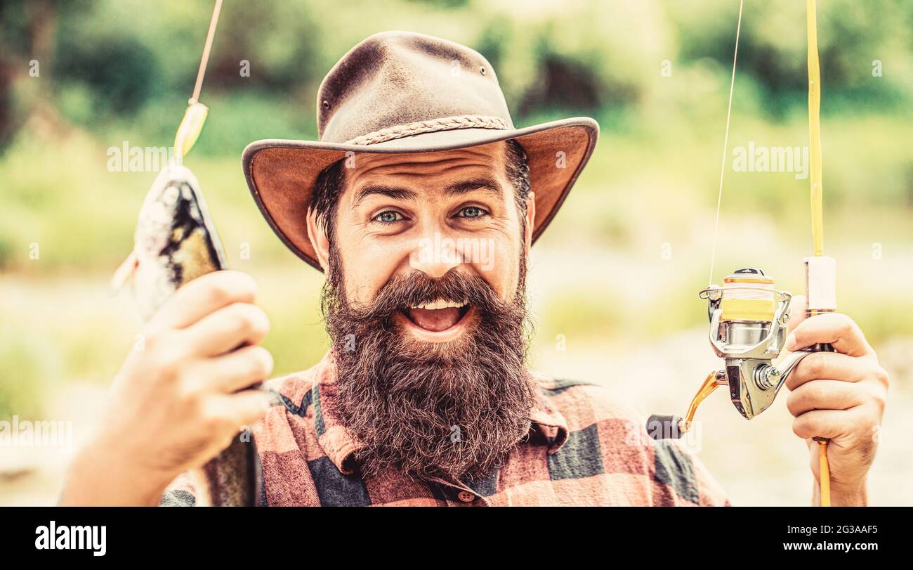 Fisherman and trophy trout. Man holding a trout fish. Fishing. Angler ...
