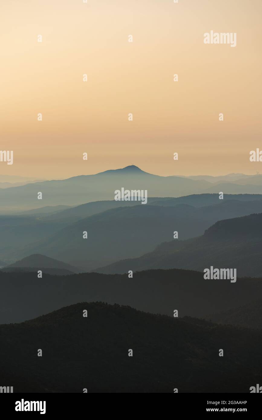 View of different gradient layers of mountains at dawn Stock Photo - Alamy