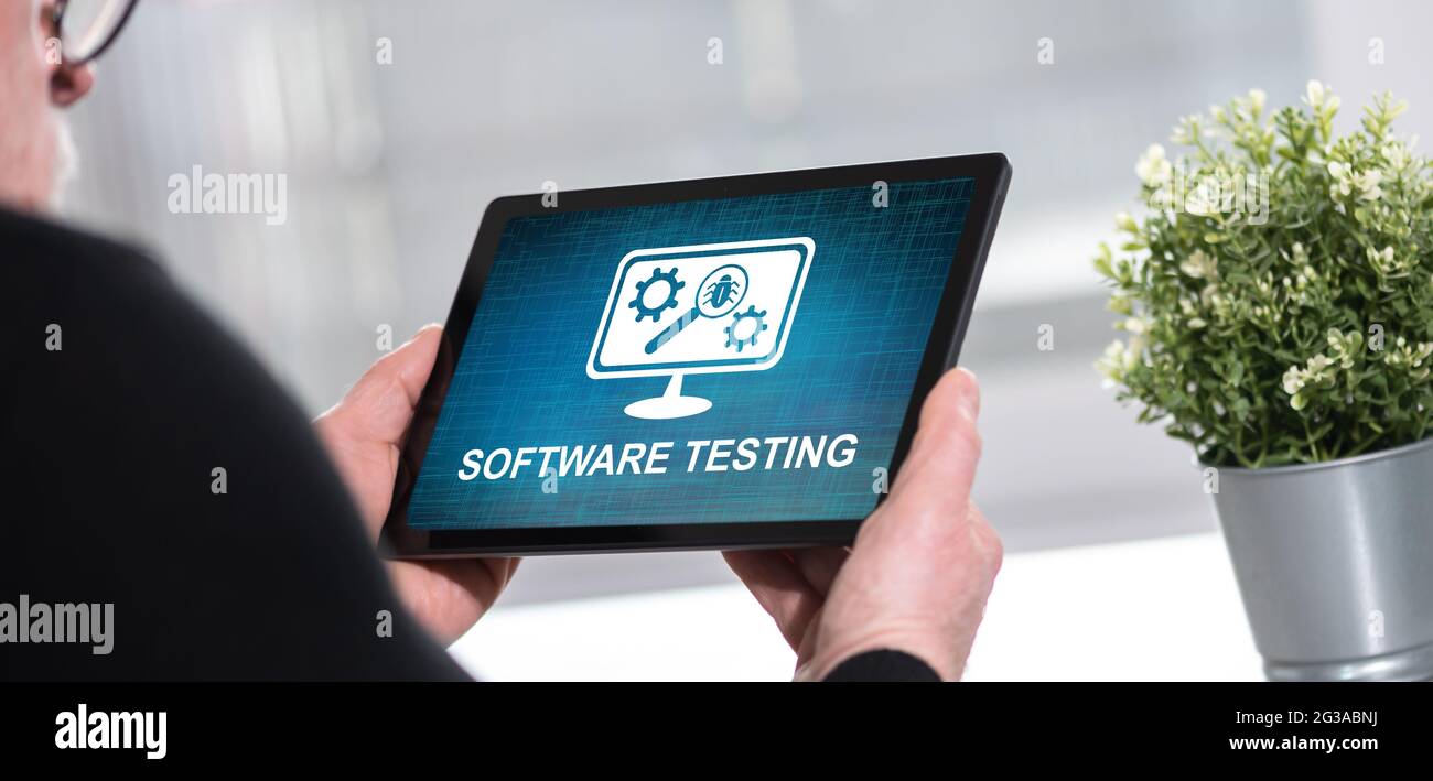 Tablet screen displaying a software testing concept Stock Photo - Alamy