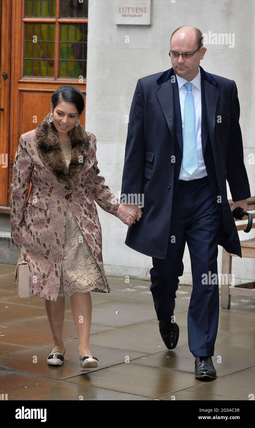 File photo dated 05/03/16 of Priti Patel and her husband Alex Sawyer ...