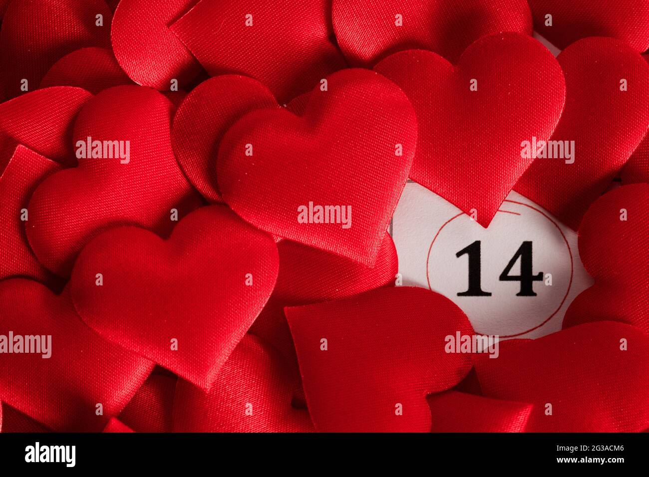 Valentine's day red silk hearts on calendar with 14 february date ...