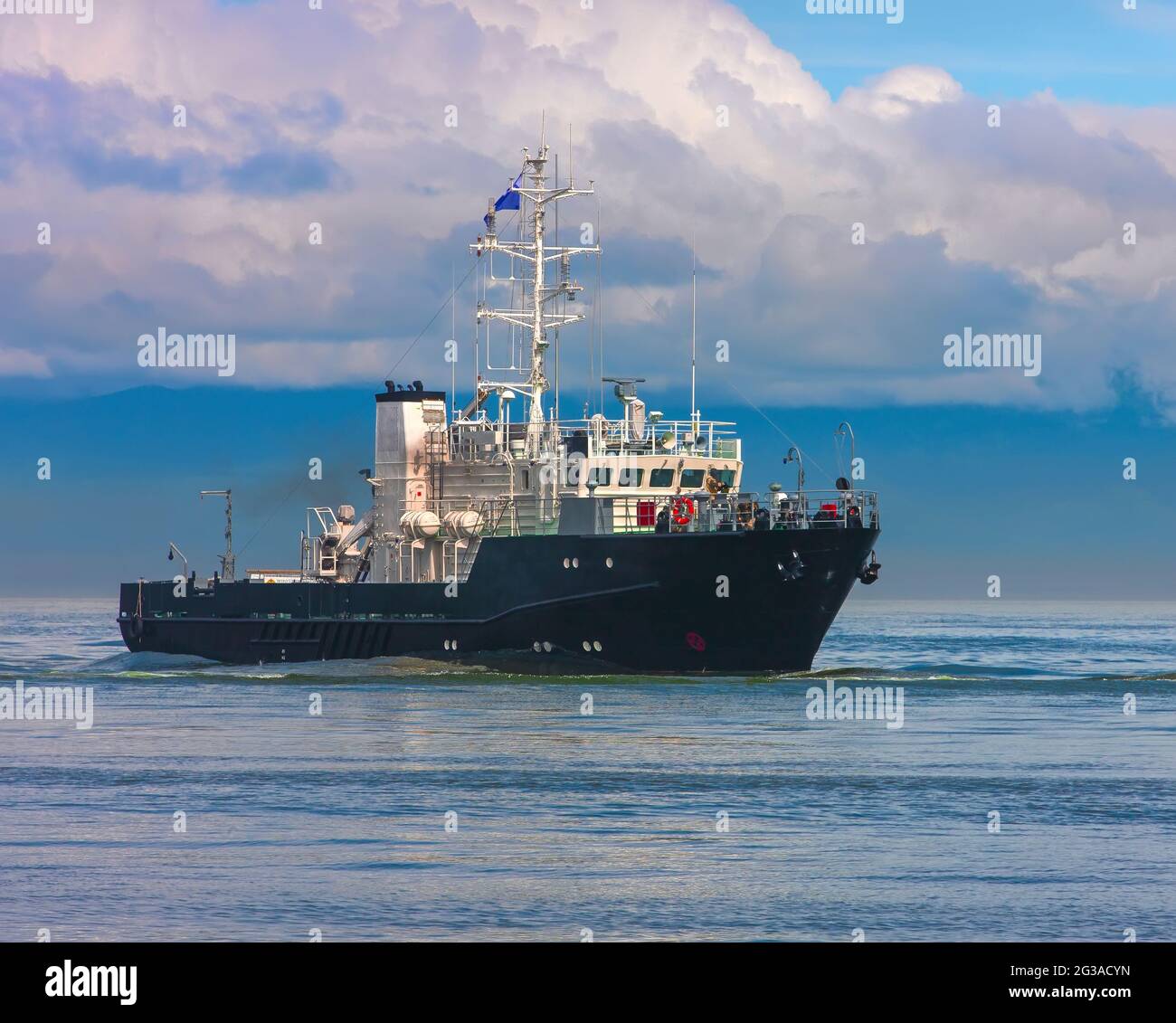 The small ship at blue sea near the coast Stock Photo - Alamy