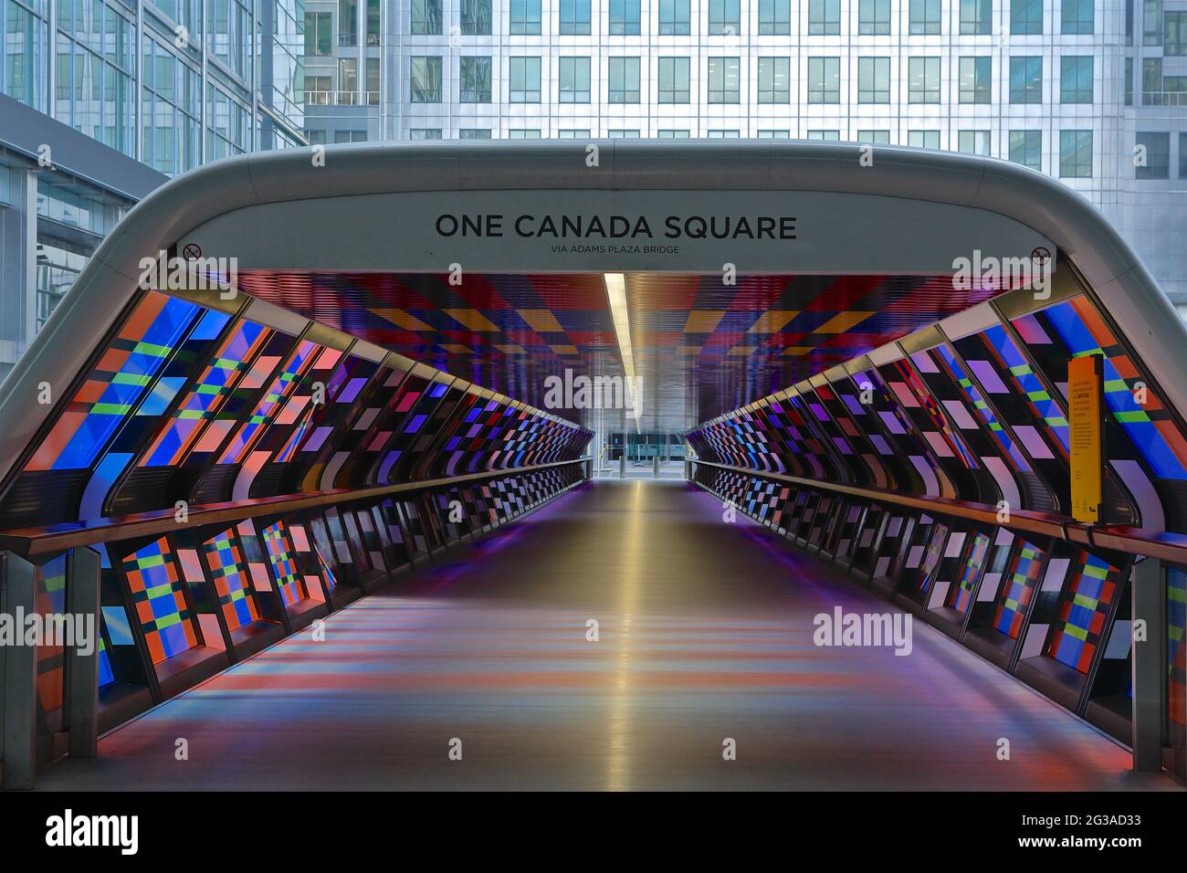 London (UK), 10 May 2021: Adams Plaza Bridge in Docklands connecting ...