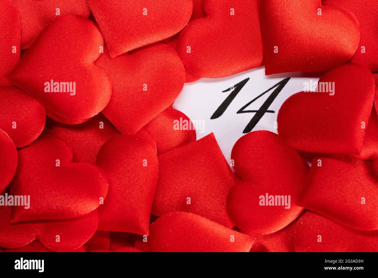 Valentine's day red silk hearts on calendar with 14 february date ...
