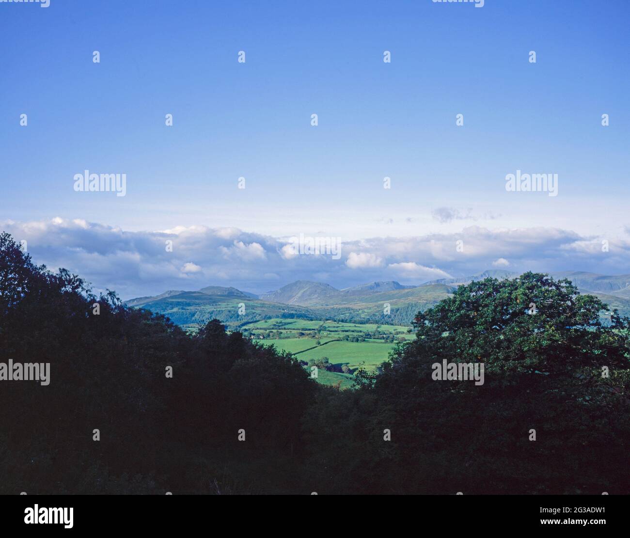 Summer morning the Conwy Valley viewed from hills above the village of ...