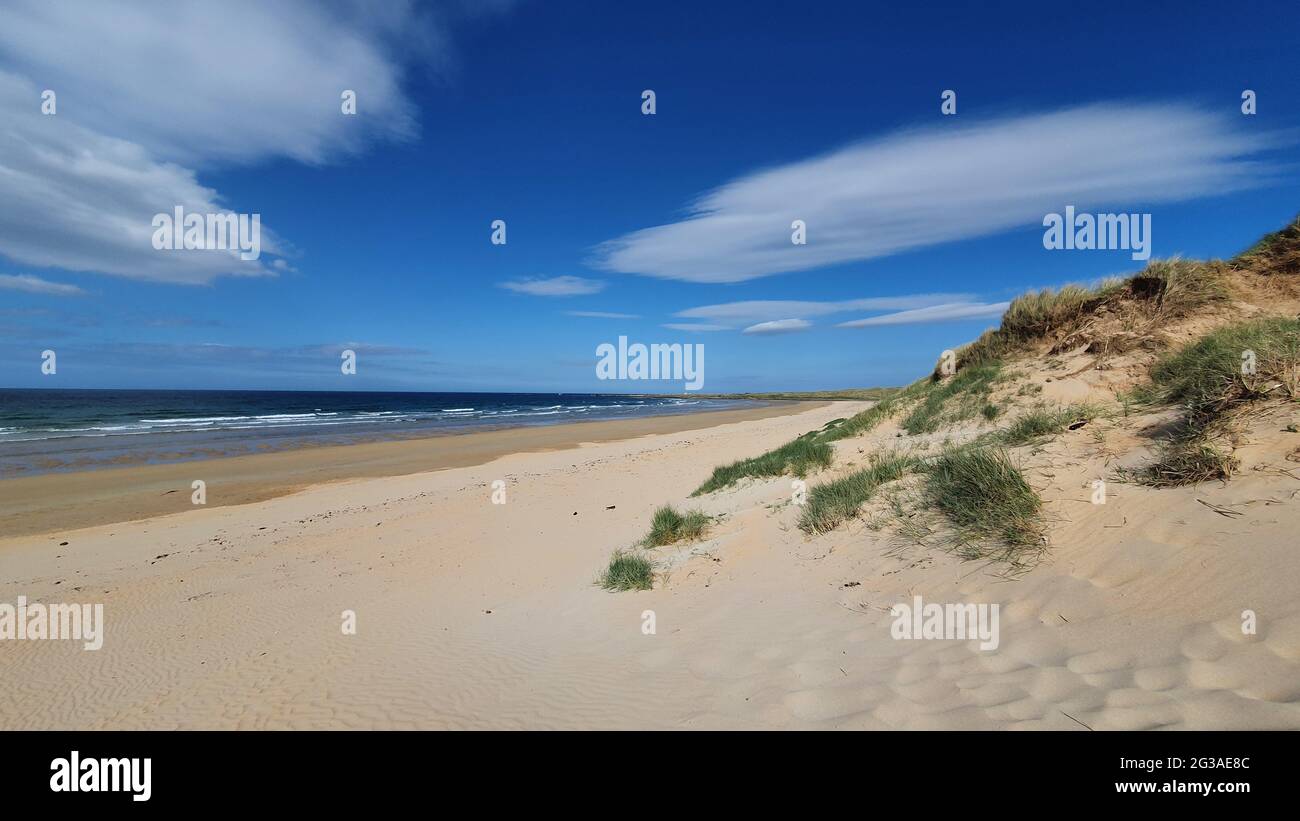 Idyllic beach scene, with no people and white clouds in blue sky Stock ...