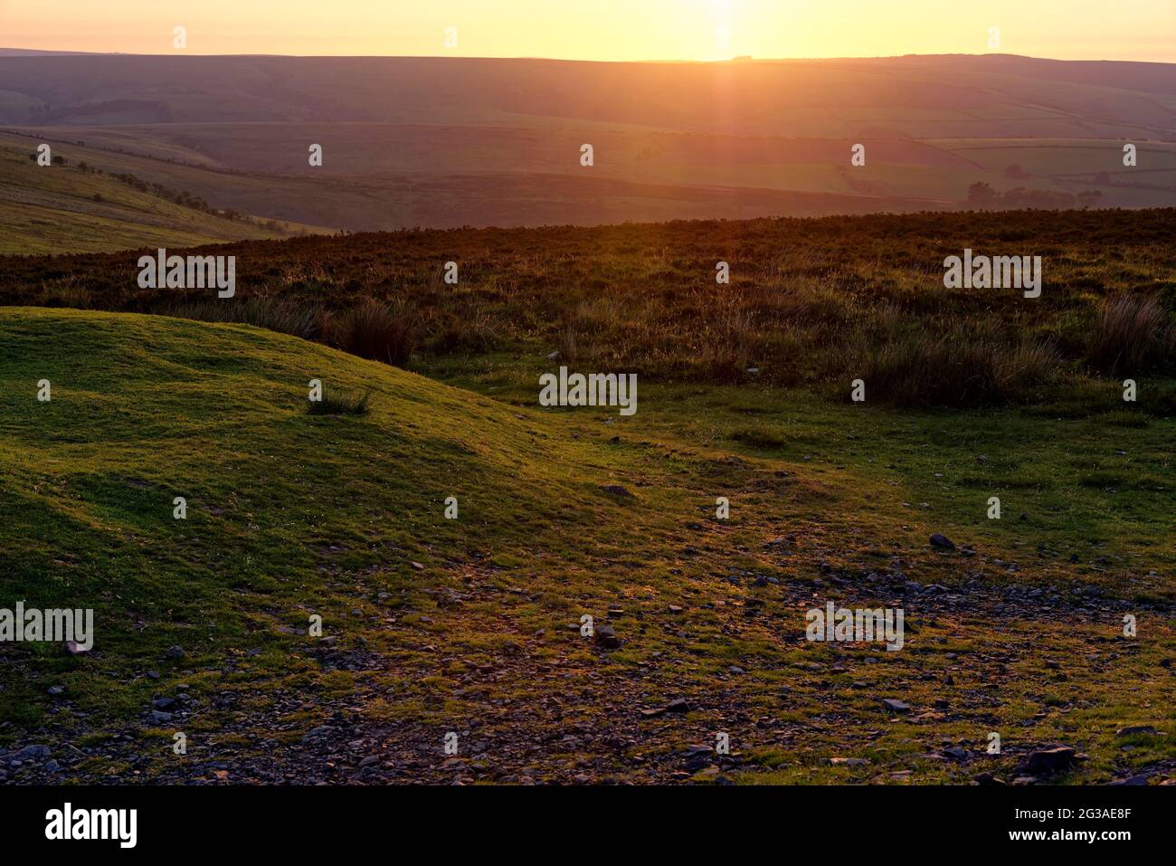 Last Sun on Dunkery Beacon with Culbone Hill on horizon, Exmoor ...