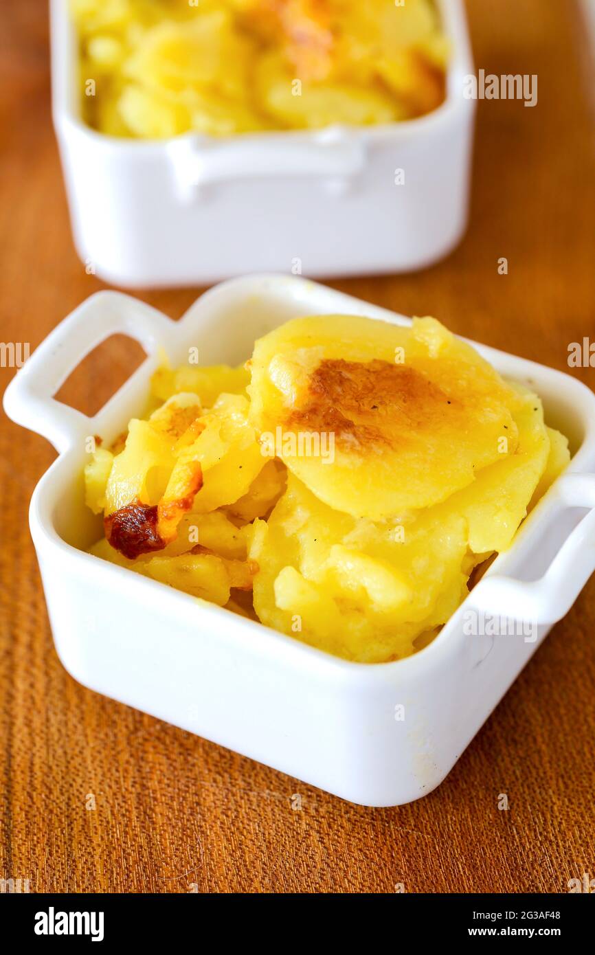 Dauphinoise Potatoes baked with Cream and Garlic in the Oven with a ...