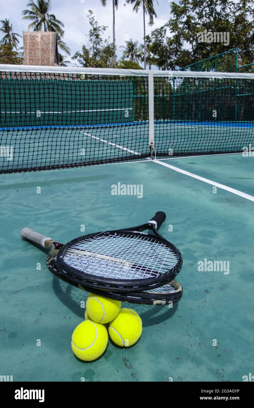 Tennis Ball with Racket on tennis court close up Stock Photo - Alamy