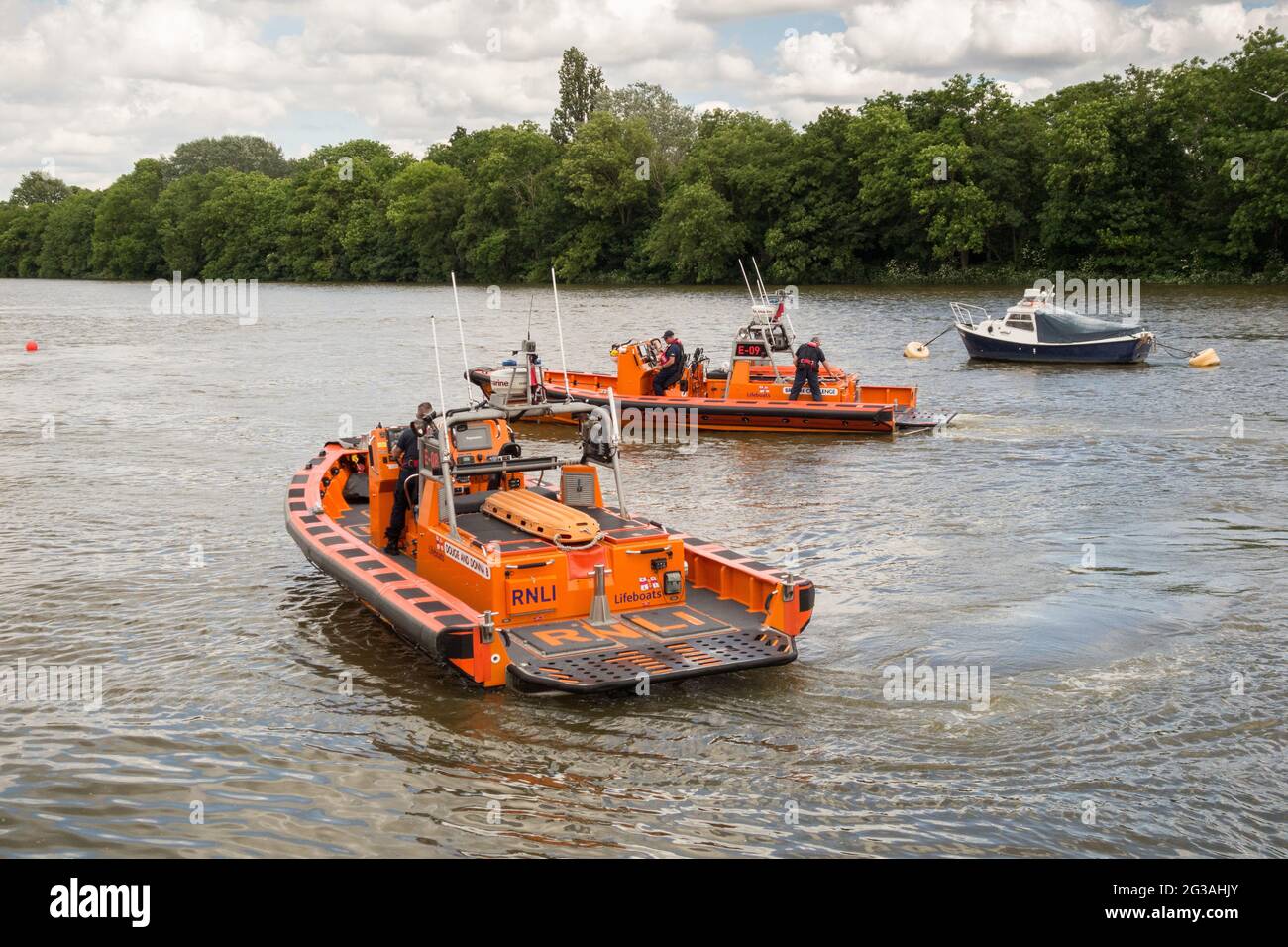 RNLI crew and inflatables on the River Thames at Chiswick Lifeboat ...