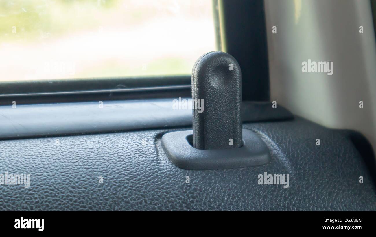 Close the lock button for the interior door of the vehicle. Door lock ...