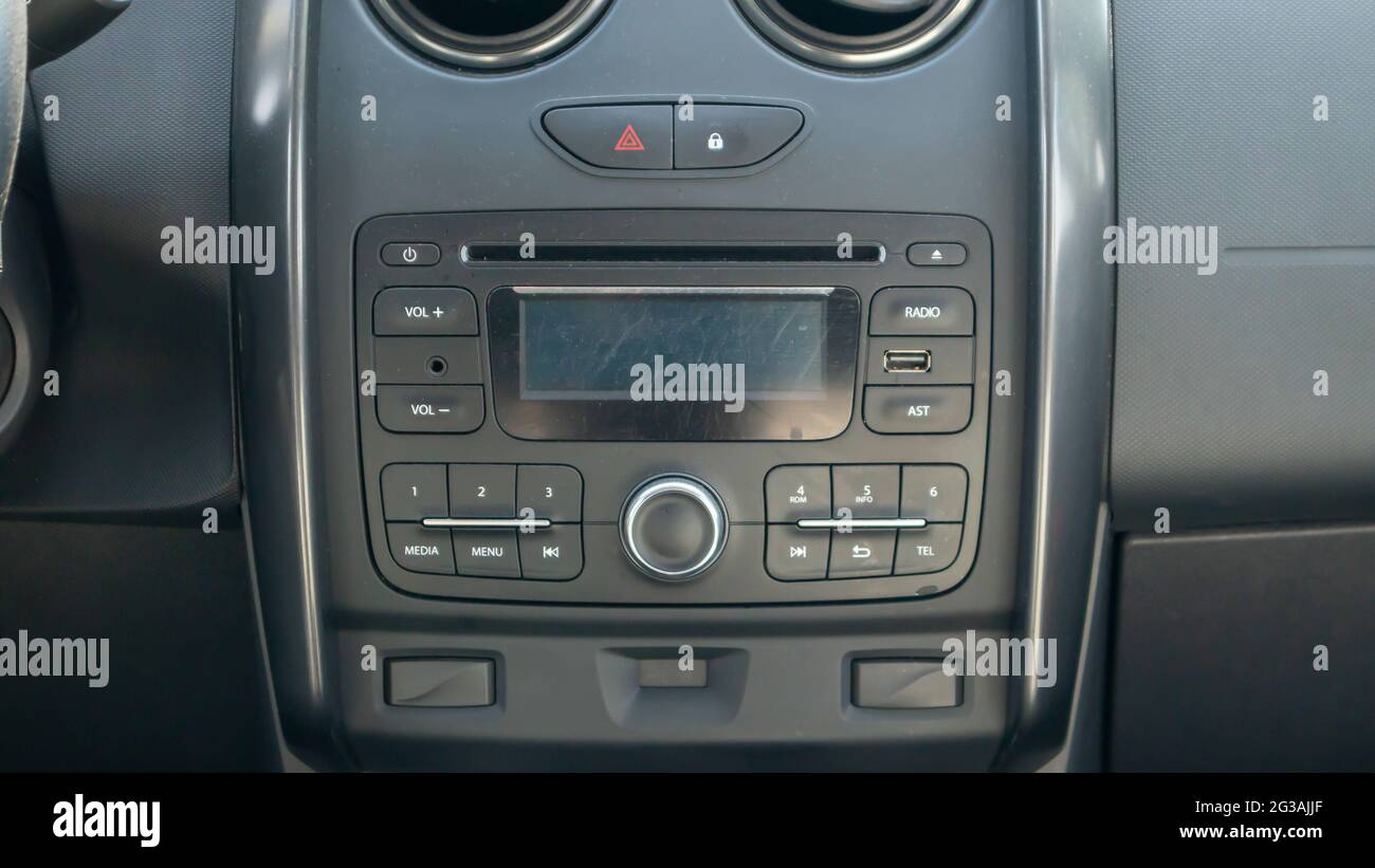 Established multimedia in the car. Close-up of the head unit and radio ...