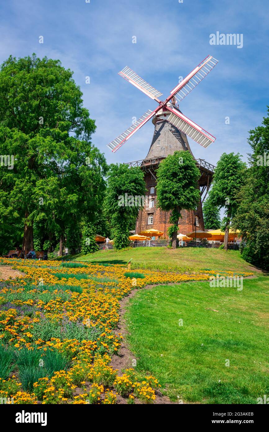 Vertical shot of a historic windmill in Wallanlagen Park, Bremen ...