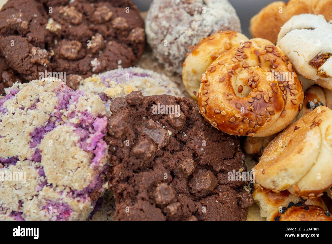Cookies in different colors and flavors. raspberry, chocolate chip ...
