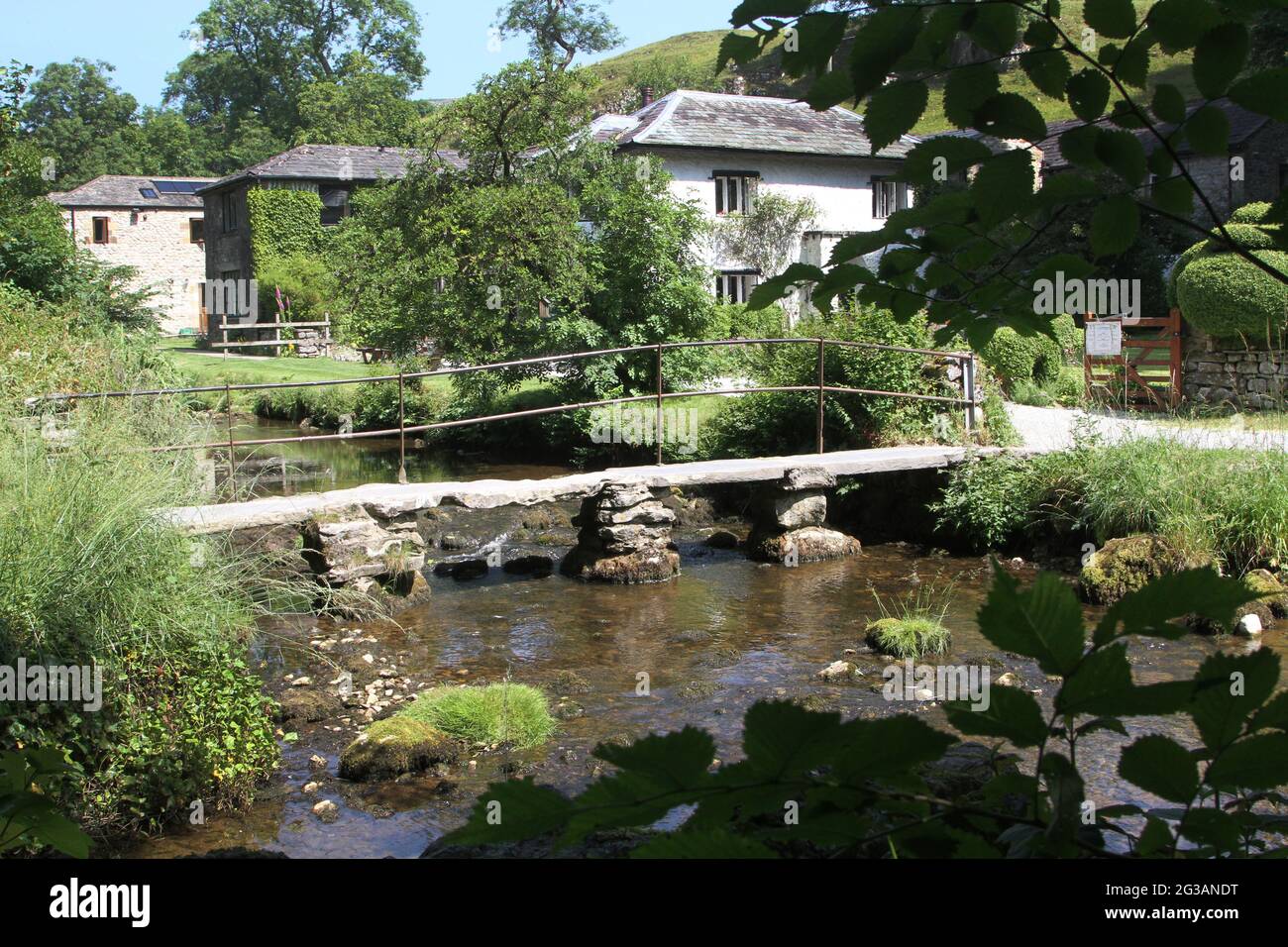 Ancient river crossing a clapper bridge, Malham, Yorkshire, England UK ...